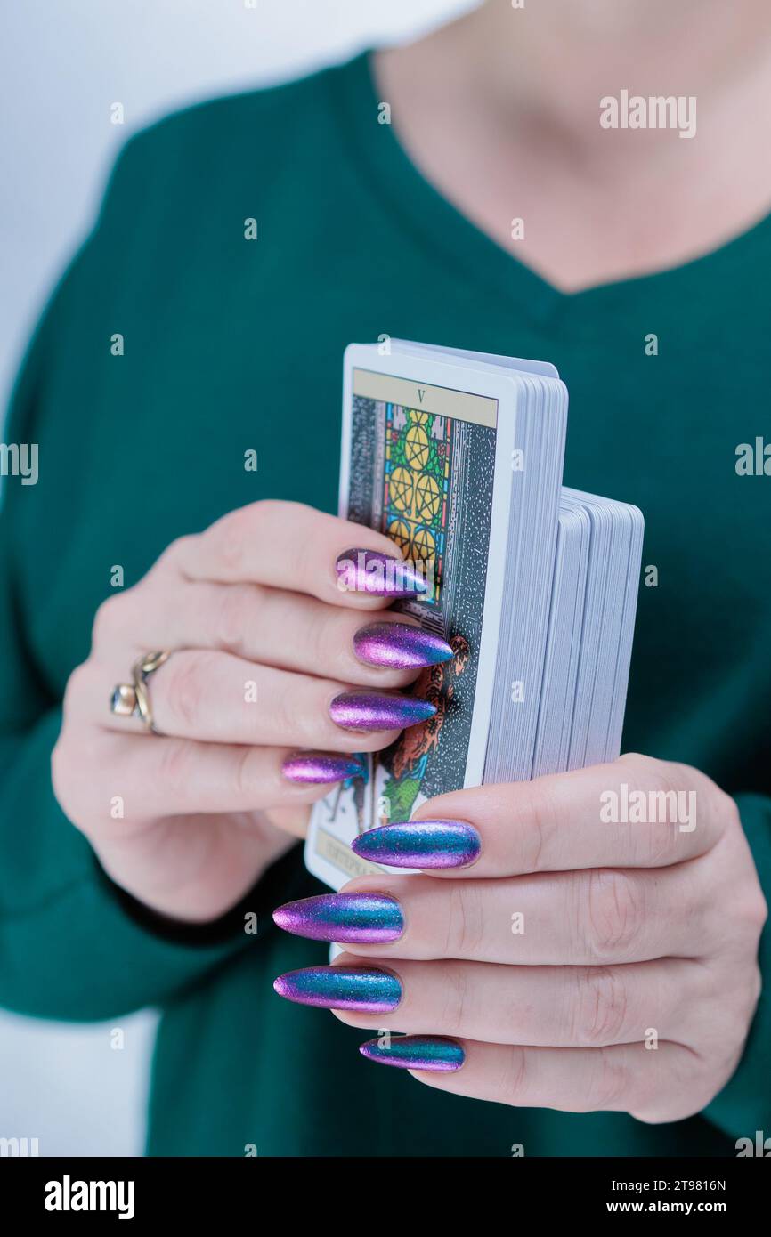 Female hands holding tarot cards for fortune telling and tricks Stock ...