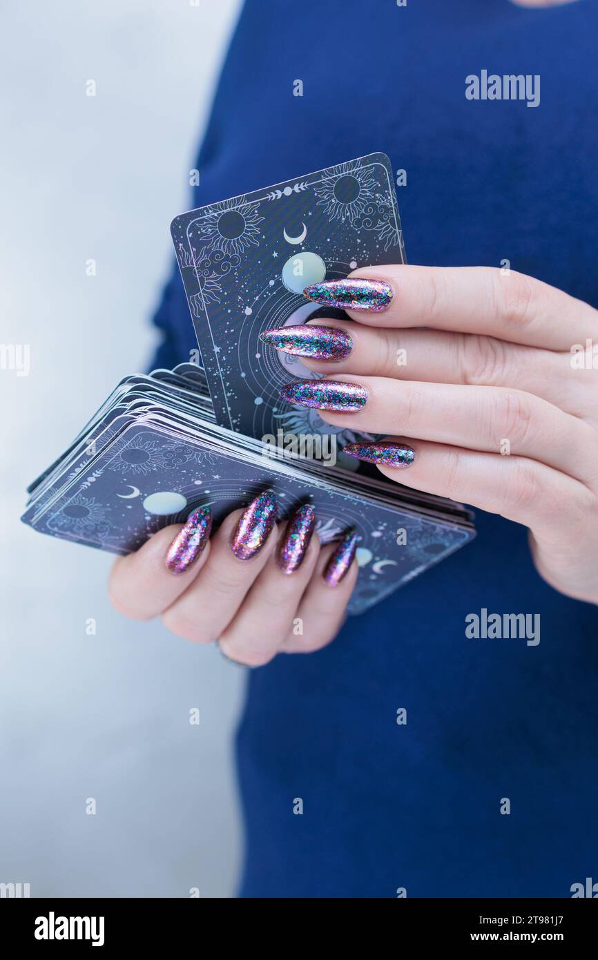 Female hands holding tarot cards for fortune telling and tricks Stock ...