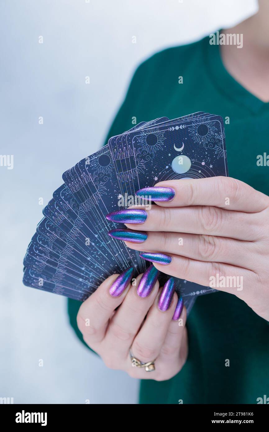 Female hands holding tarot cards for fortune telling and tricks Stock ...