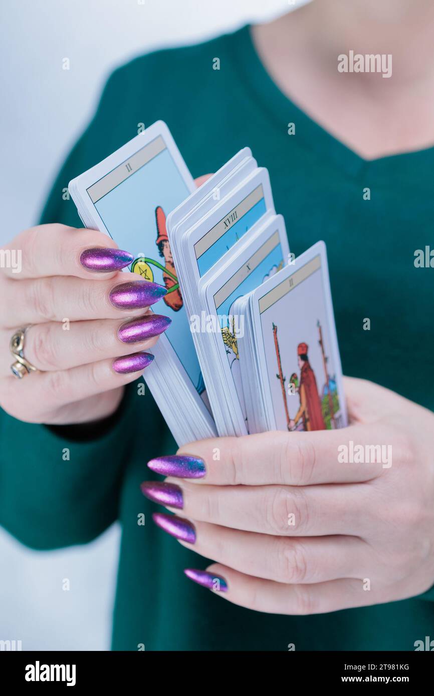Female hands holding tarot cards for fortune telling and tricks Stock ...