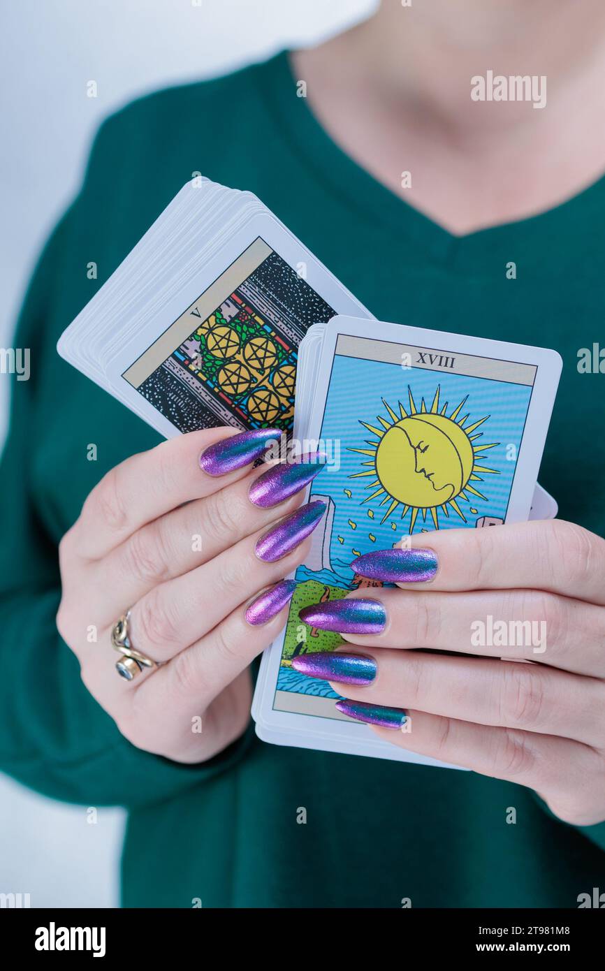 Female hands holding tarot cards for fortune telling and tricks Stock ...