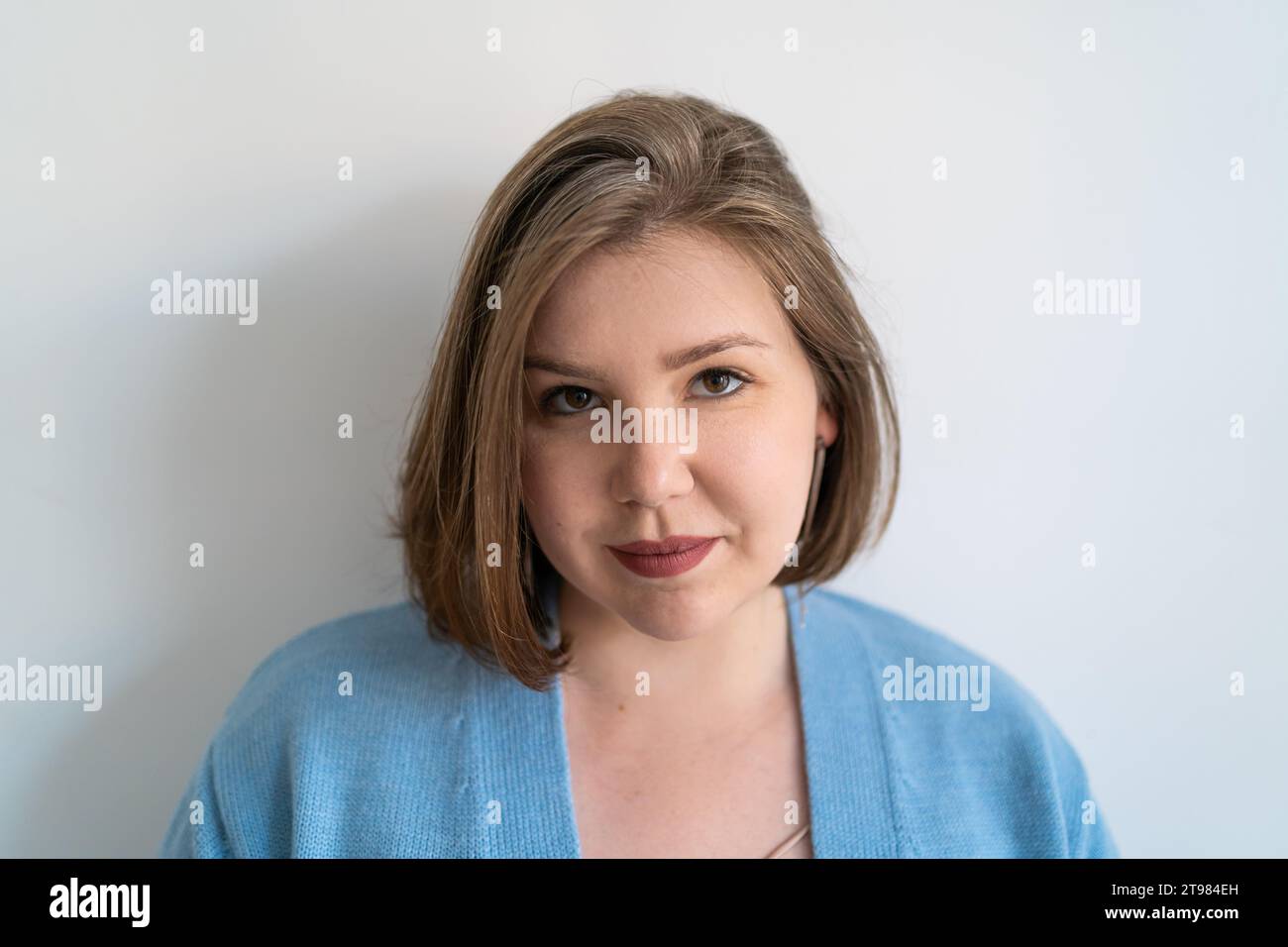 Smiling plus size woman looks to camera. Portrait of healthy happy ...