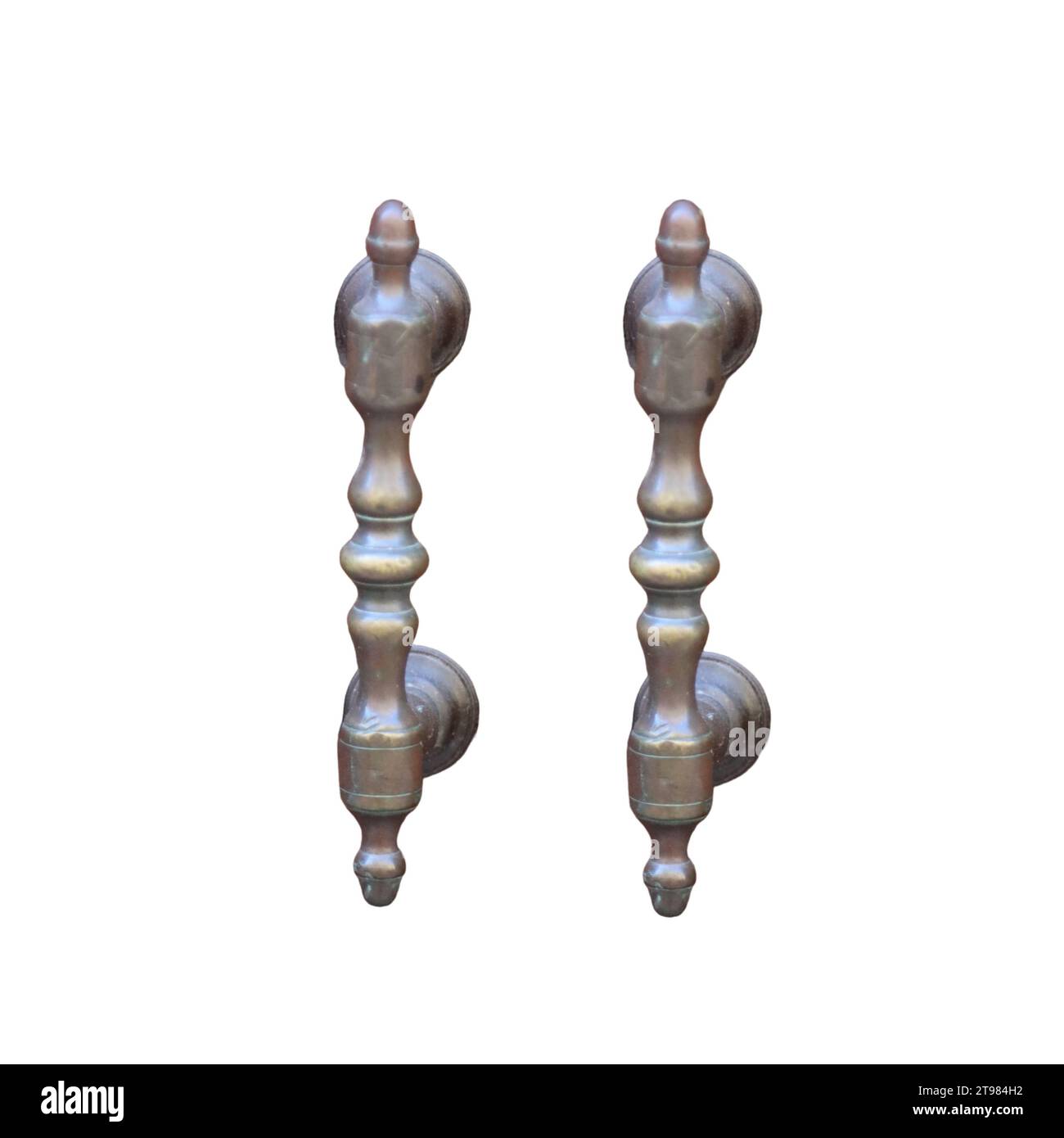 Two large antique metal columns with ornate curved tops and elegantly ...