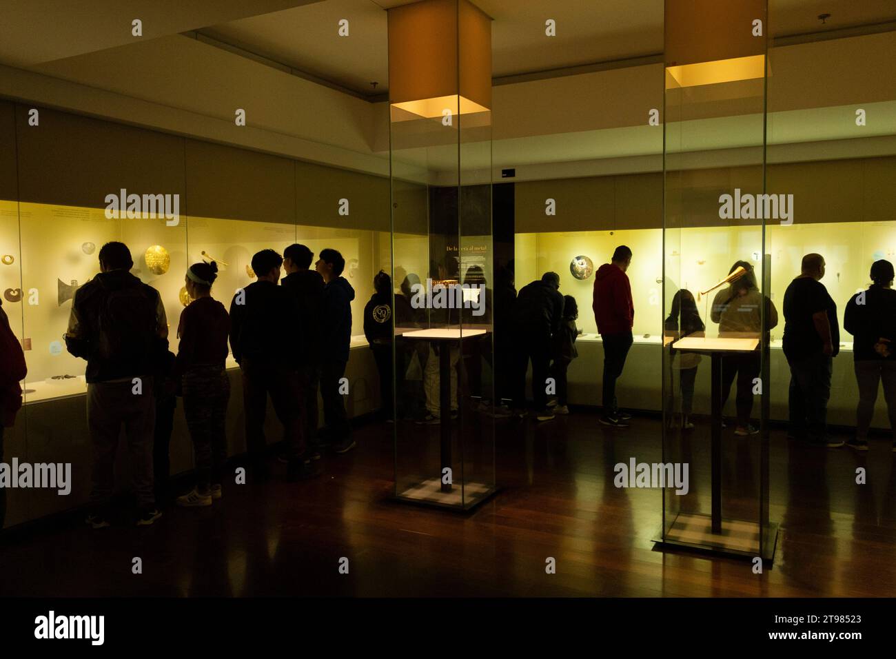 famous Colombian golden museum rooms with visitors and golden pieces ...