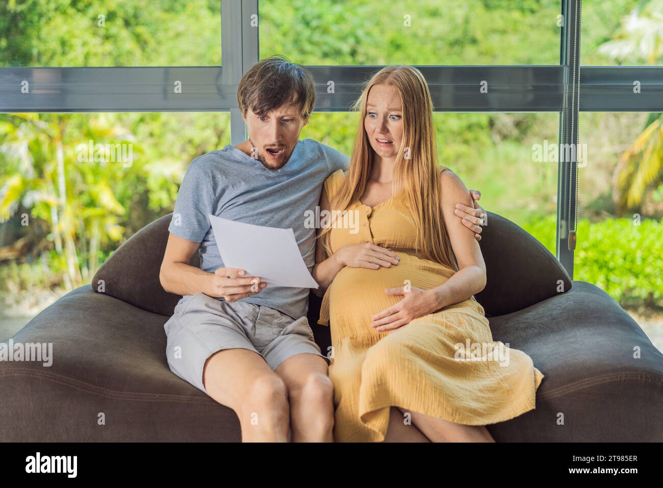 Cost of Pregnancy And Family Budgeting Concept. Young couple expecting ...