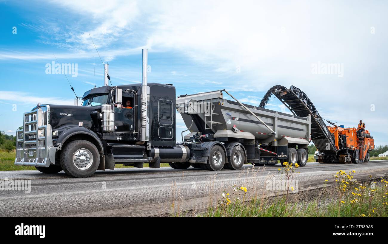Macamic, Quebec, Canada, 2023-08-21 : Black semi trailer with a orange ...