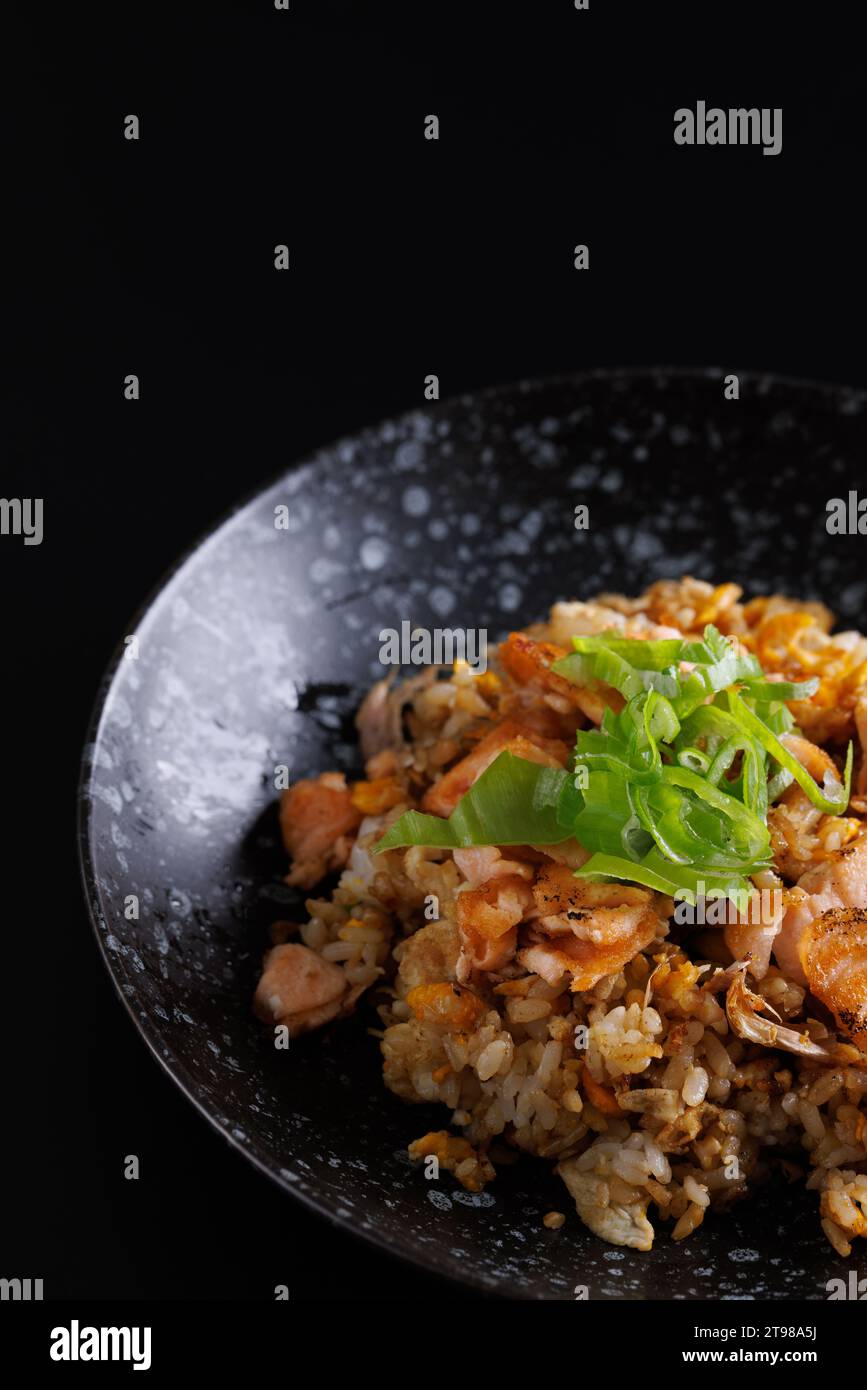 Japanese fried rice yakimeshi isolated in black background Stock Photo ...