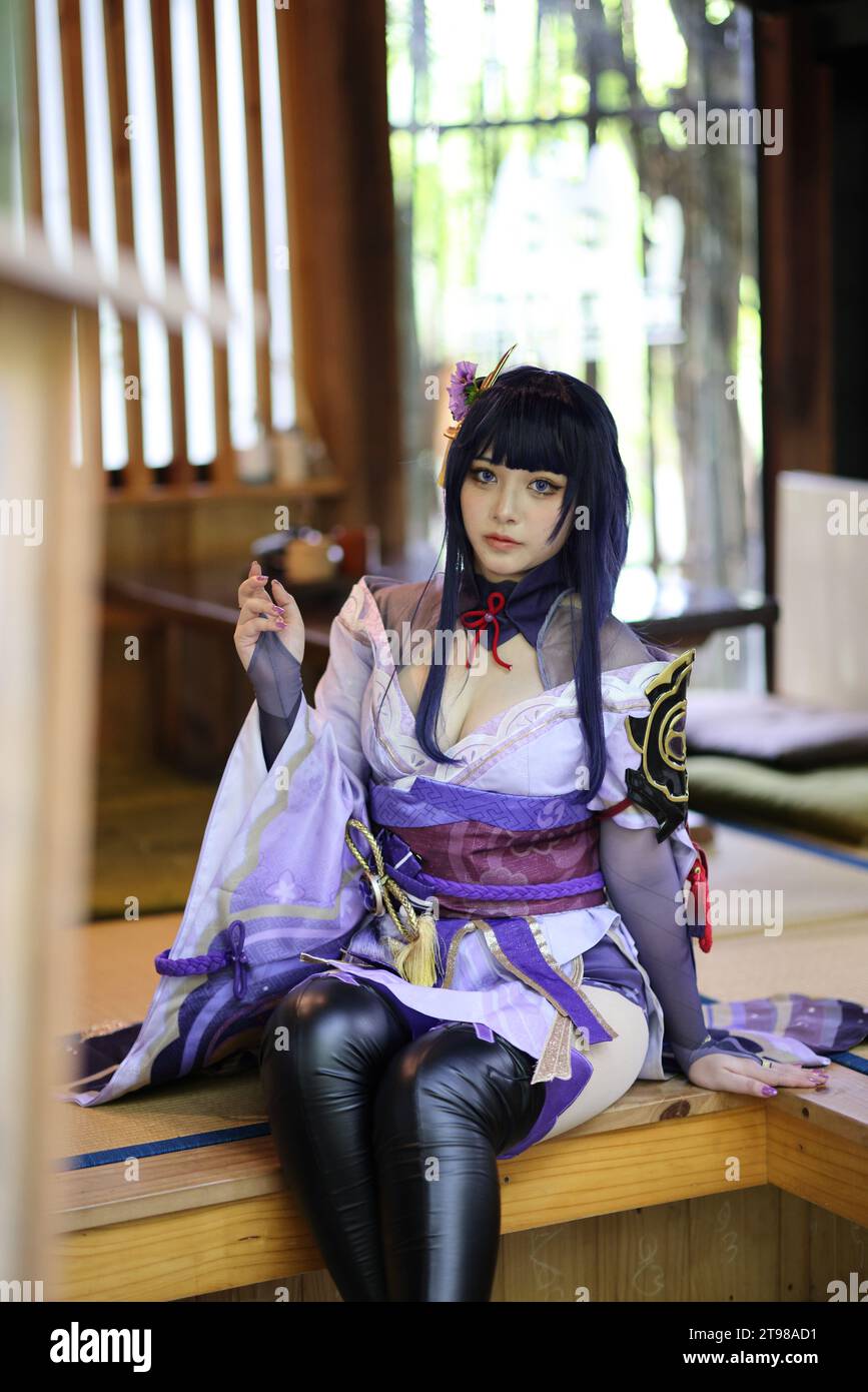 Portrait of a beautiful young woman game cosplay with samurai dress ...