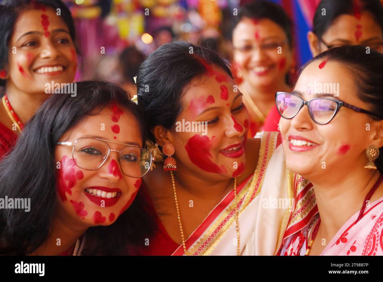 Married ladies smear red Sindoor or Vermillion, a ritual known as ...