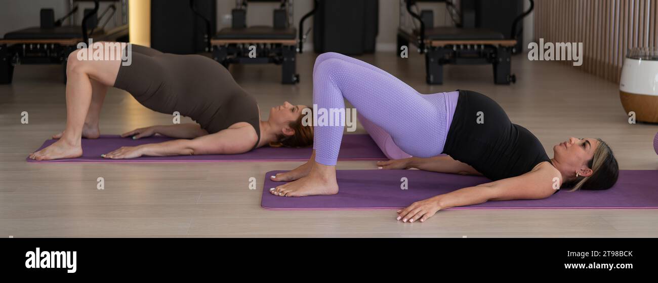 Two pregnant women do pelvic floor strengthening exercises. Gluteal ...