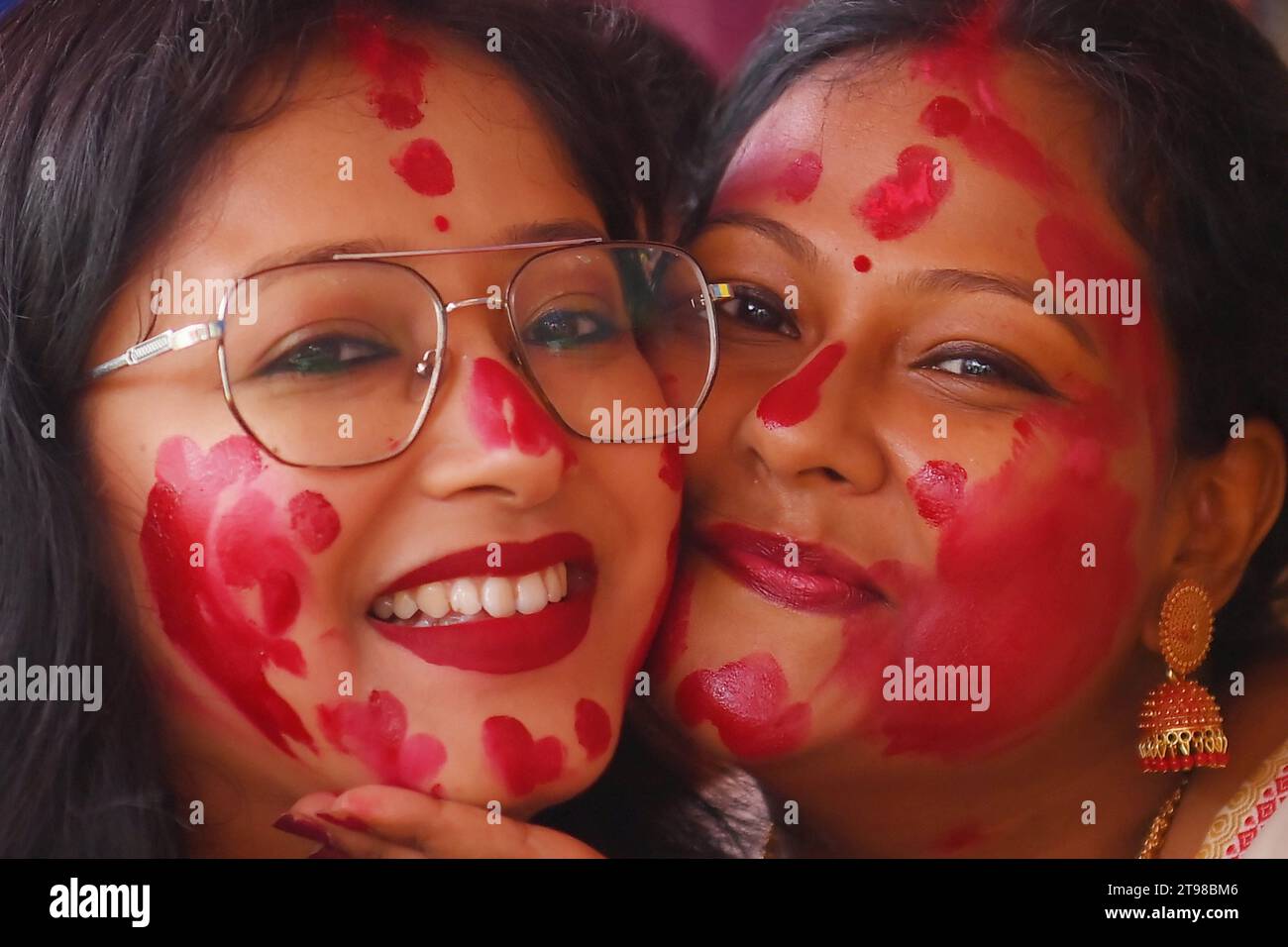 Married ladies smear red Sindoor or Vermillion, a ritual known as ...