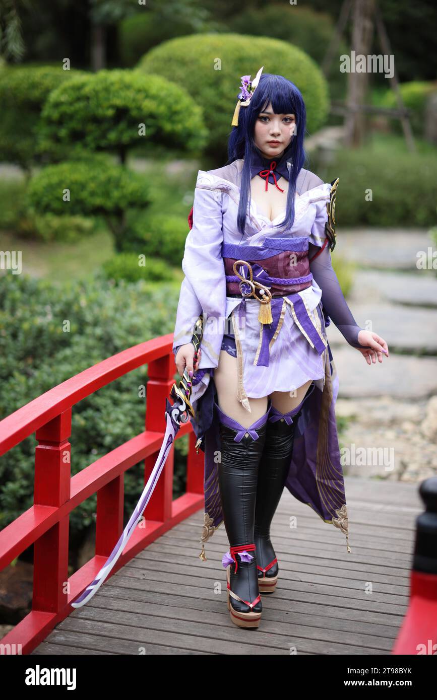 Portrait of a beautiful young woman game cosplay with samurai dress ...