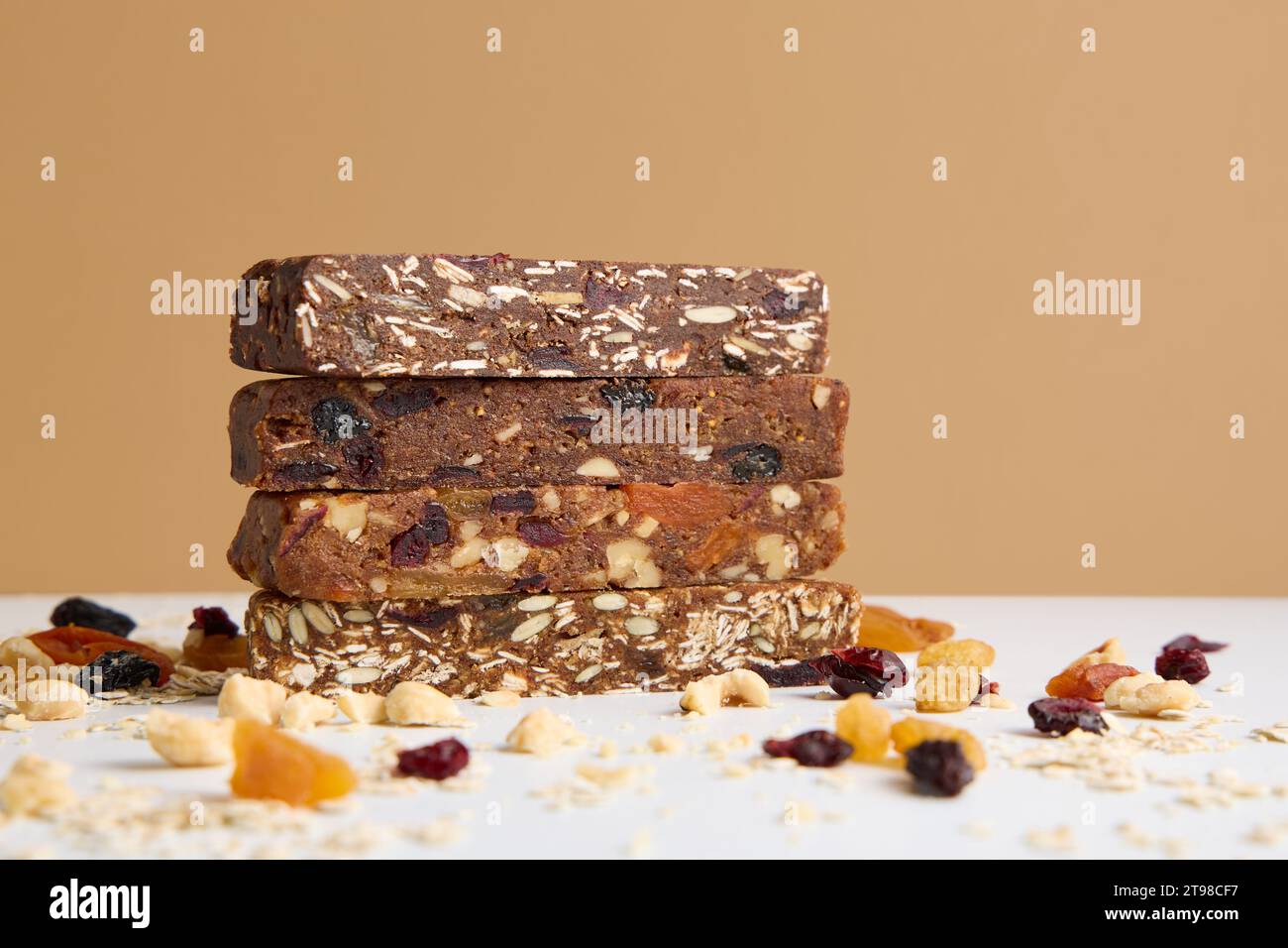 Healthy vegan bars with dried fruits and nuts on brown background ...