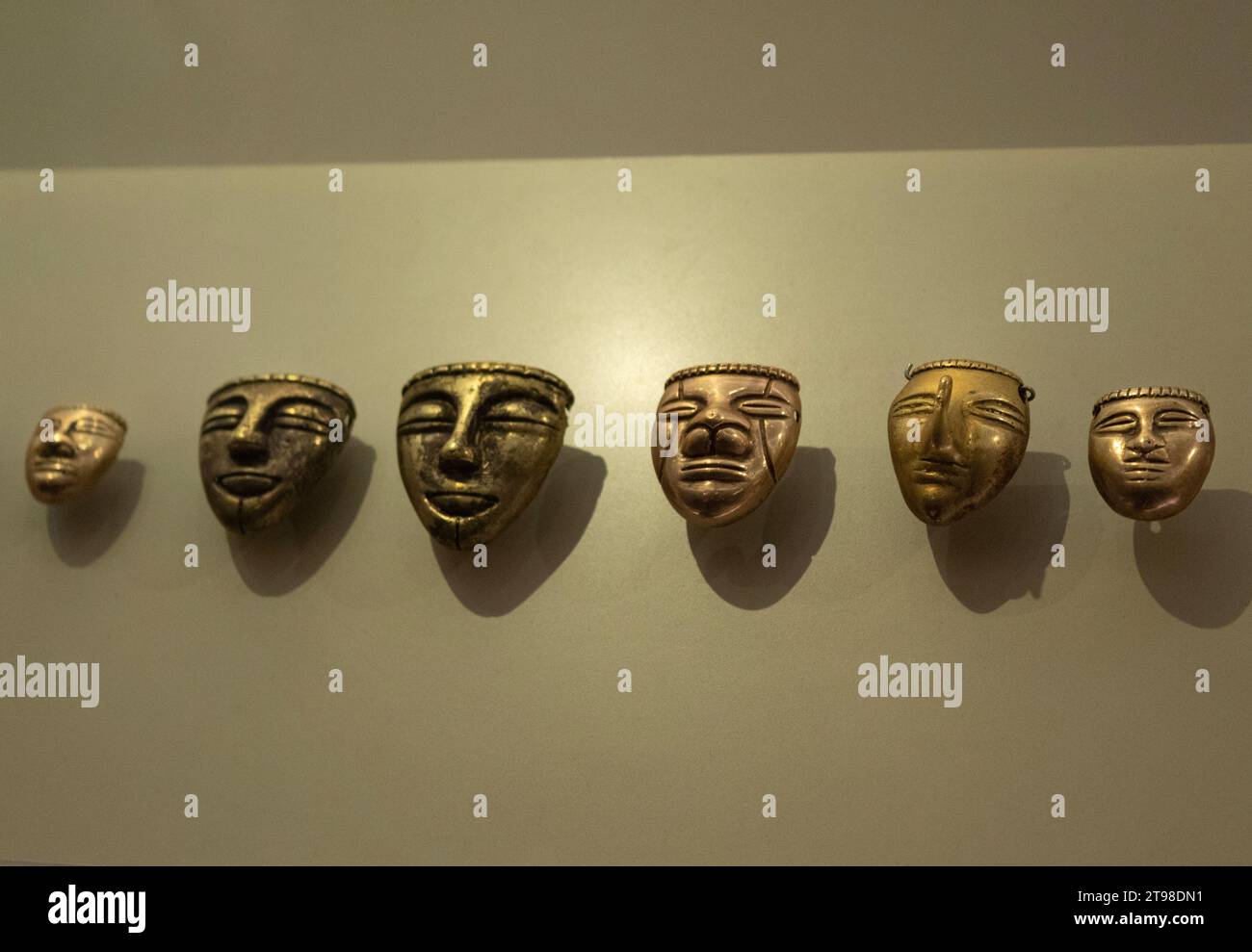 Colombian ancient indigenous culture golden small faces pieces at ...