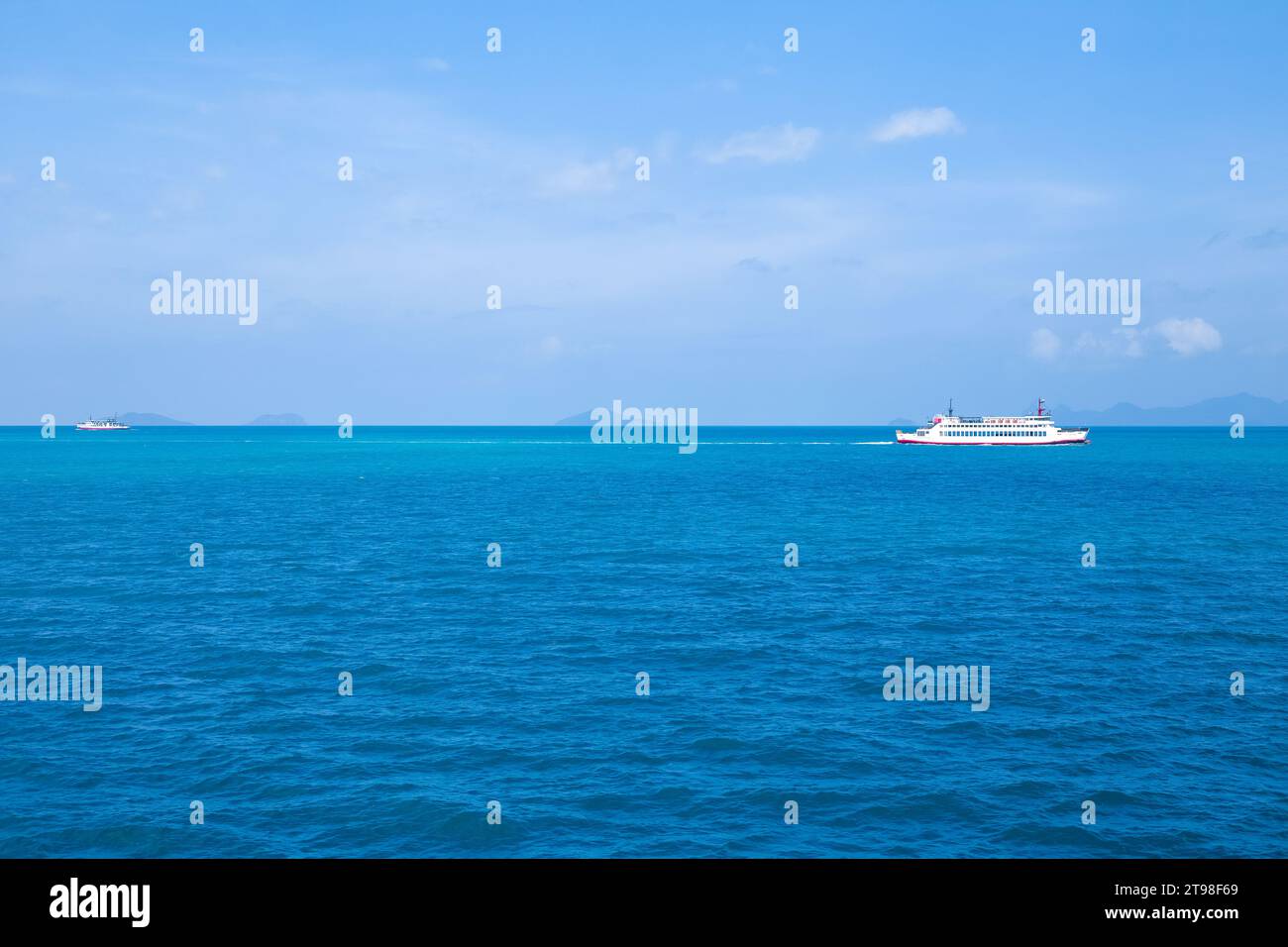 A cargo ferry sails across the blue sea on the Gulf of Thailand Stock ...