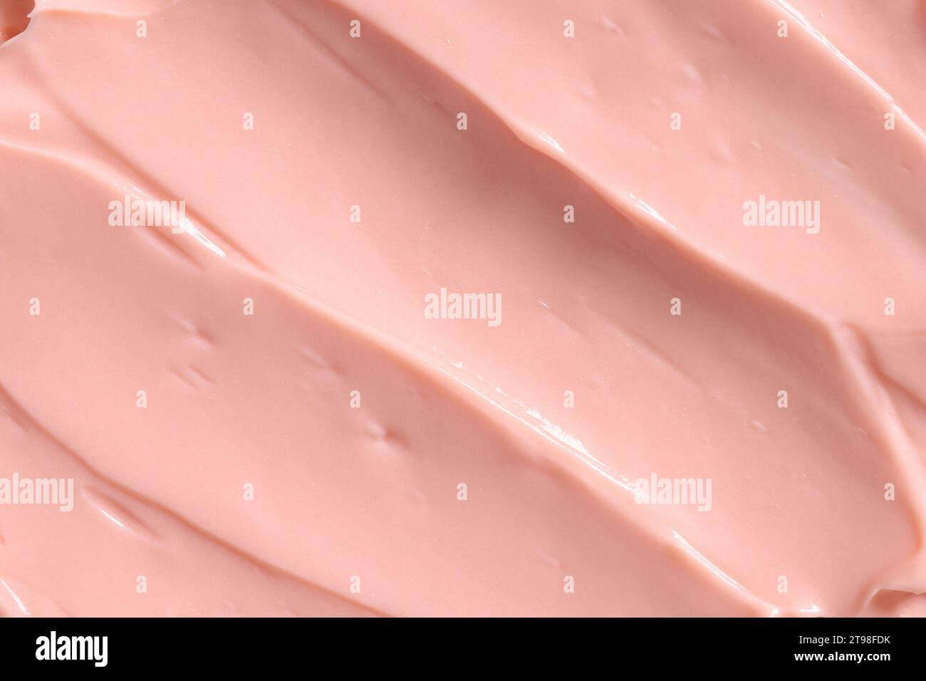 Pink skin care cosmetic beauty cream texture background in close up ...