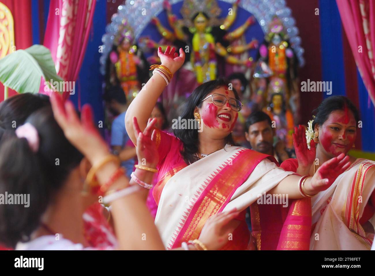 Married ladies smear red Sindoor or Vermillion, a ritual known as ...