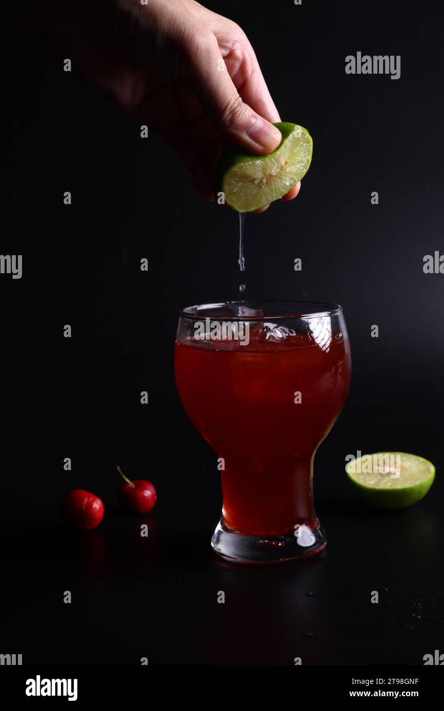 lemon iced tea isolated in black background Stock Photo - Alamy