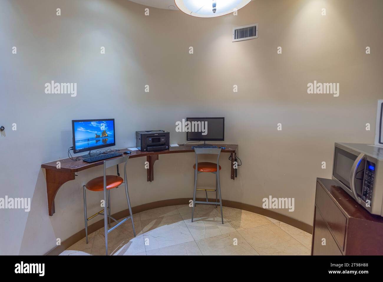 Interior view of small hotel room equipped with computers, printer and ...
