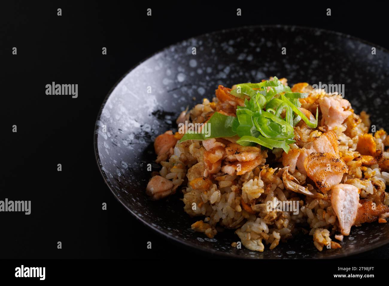 Japanese fried rice yakimeshi isolated in black background Stock Photo ...