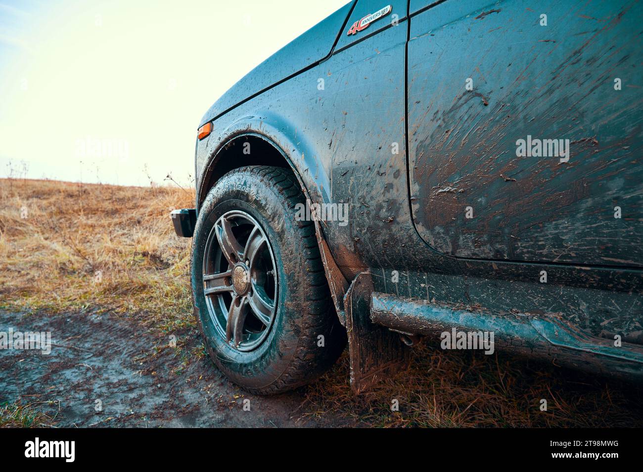 Ryazan, Russia - November 15, 2023: Dirty front wheel of an all-wheel ...