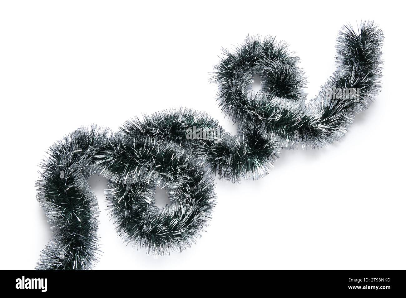 Christmas tinsel on white background Stock Photo - Alamy