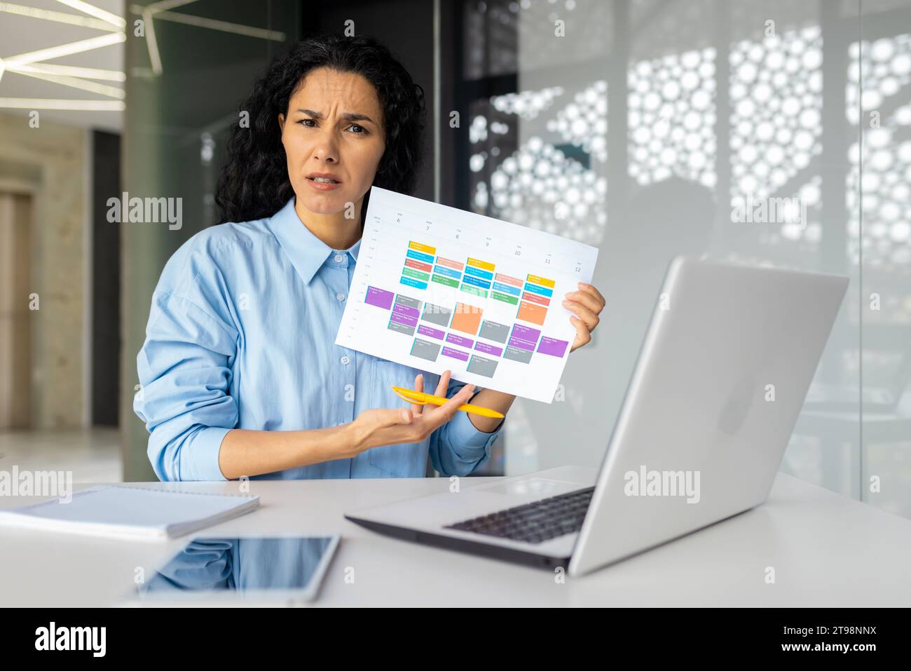 Portrait of dissatisfied excited businesswoman at workplace inside ...