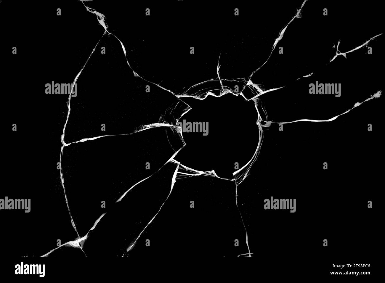 Broken glass from a bullet. Texture of broken glass Stock Photo - Alamy