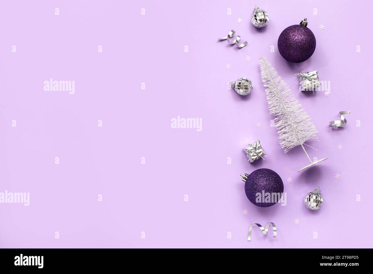 Christmas decor on lilac background Stock Photo - Alamy