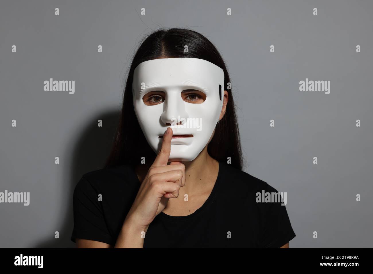 Multiple personality concept. Woman in mask on grey background Stock ... Multiple personality concept. Woman in mask on grey background Stock ...