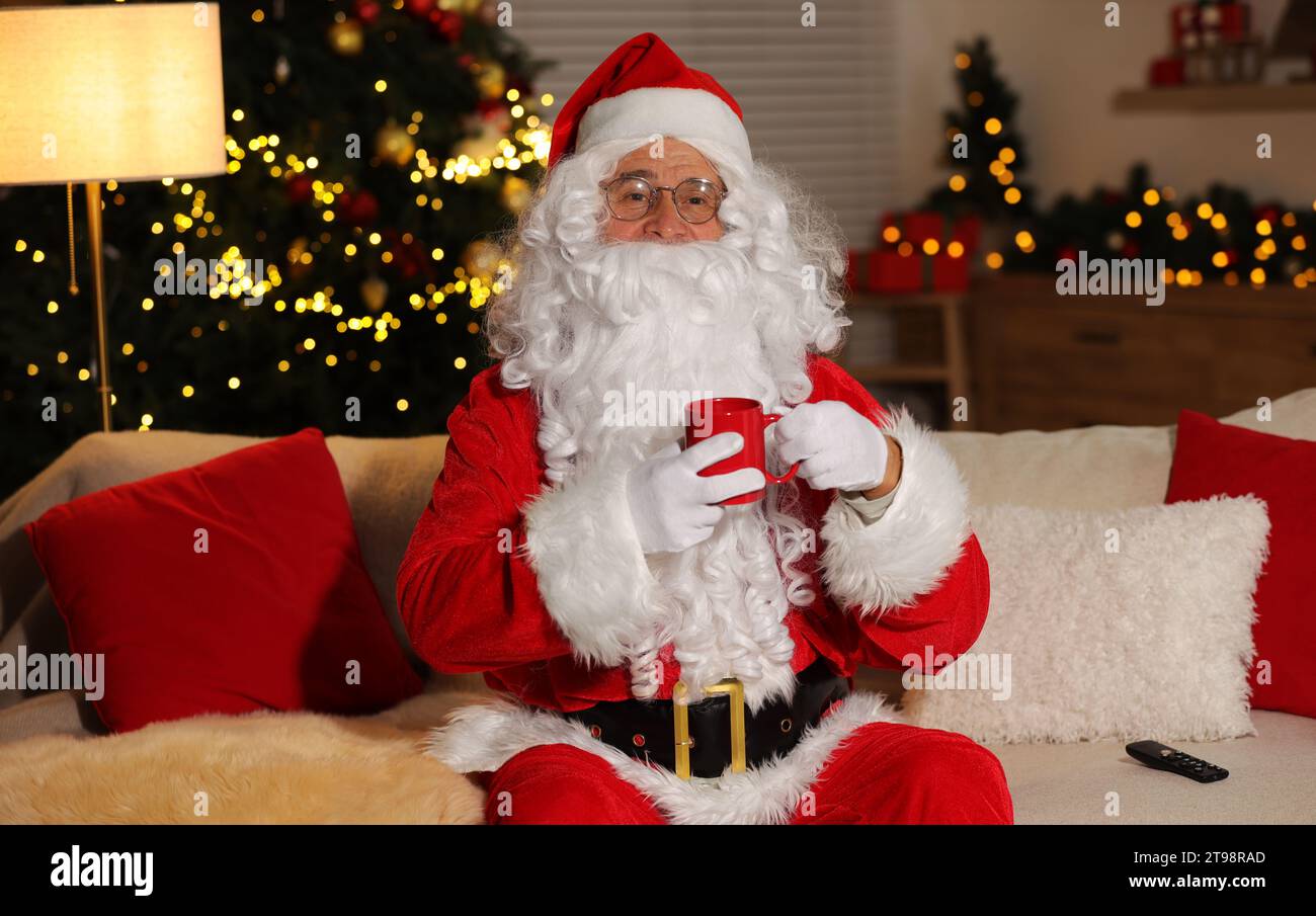 Santa watching tv hi-res stock photography and images - Alamy