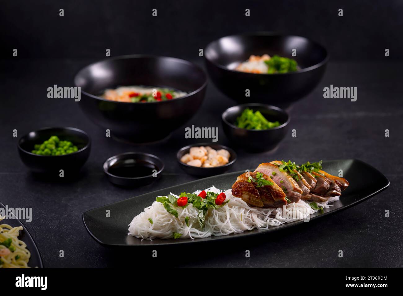 Various dishes of Asian cuisine with different types noodles and rice ...