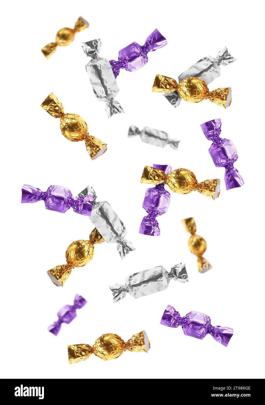 Tasty candies in bright wrappers falling on white background Stock ...