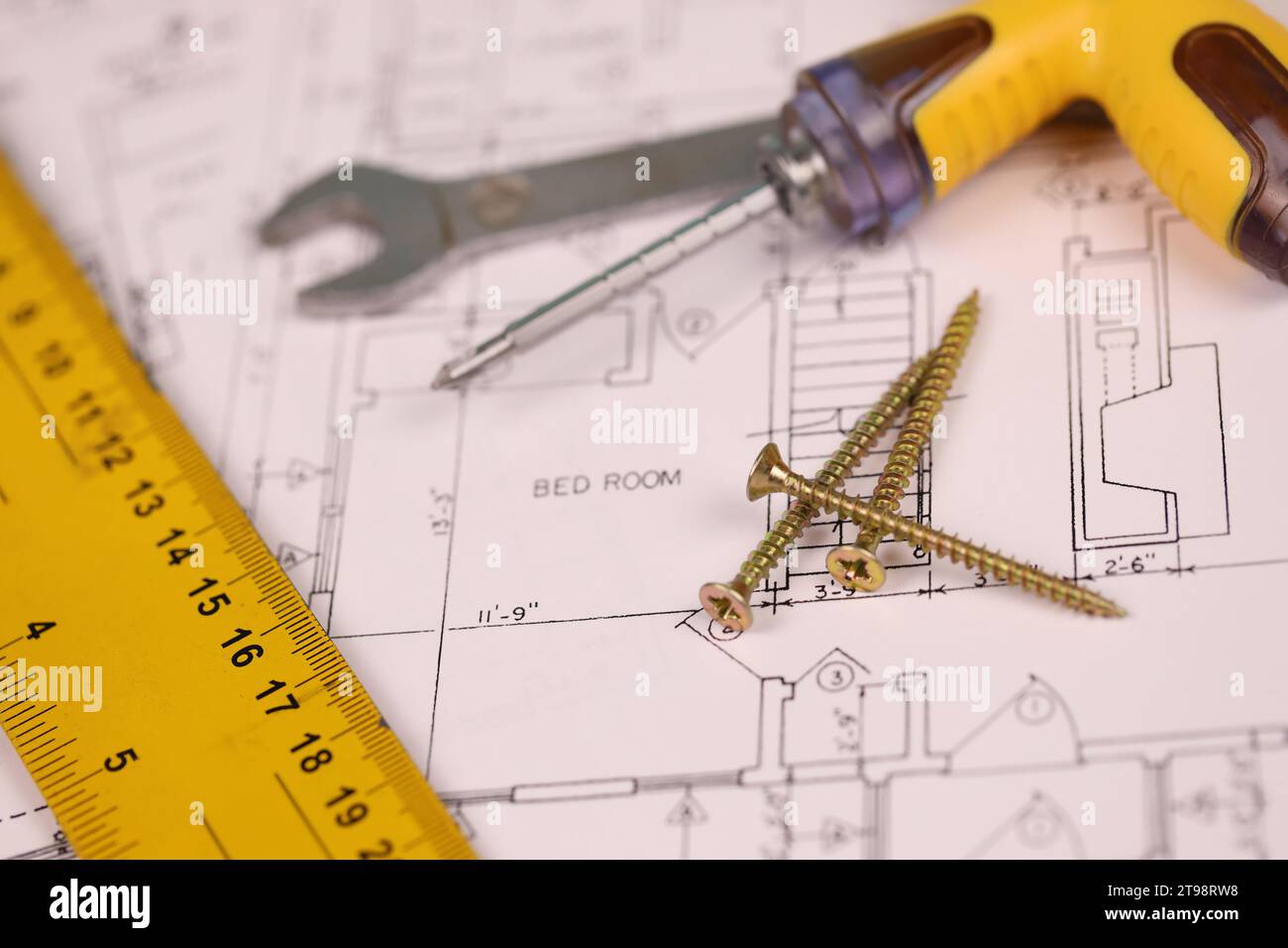 Spanner, screws and other repair tools on blueprints of residential ...