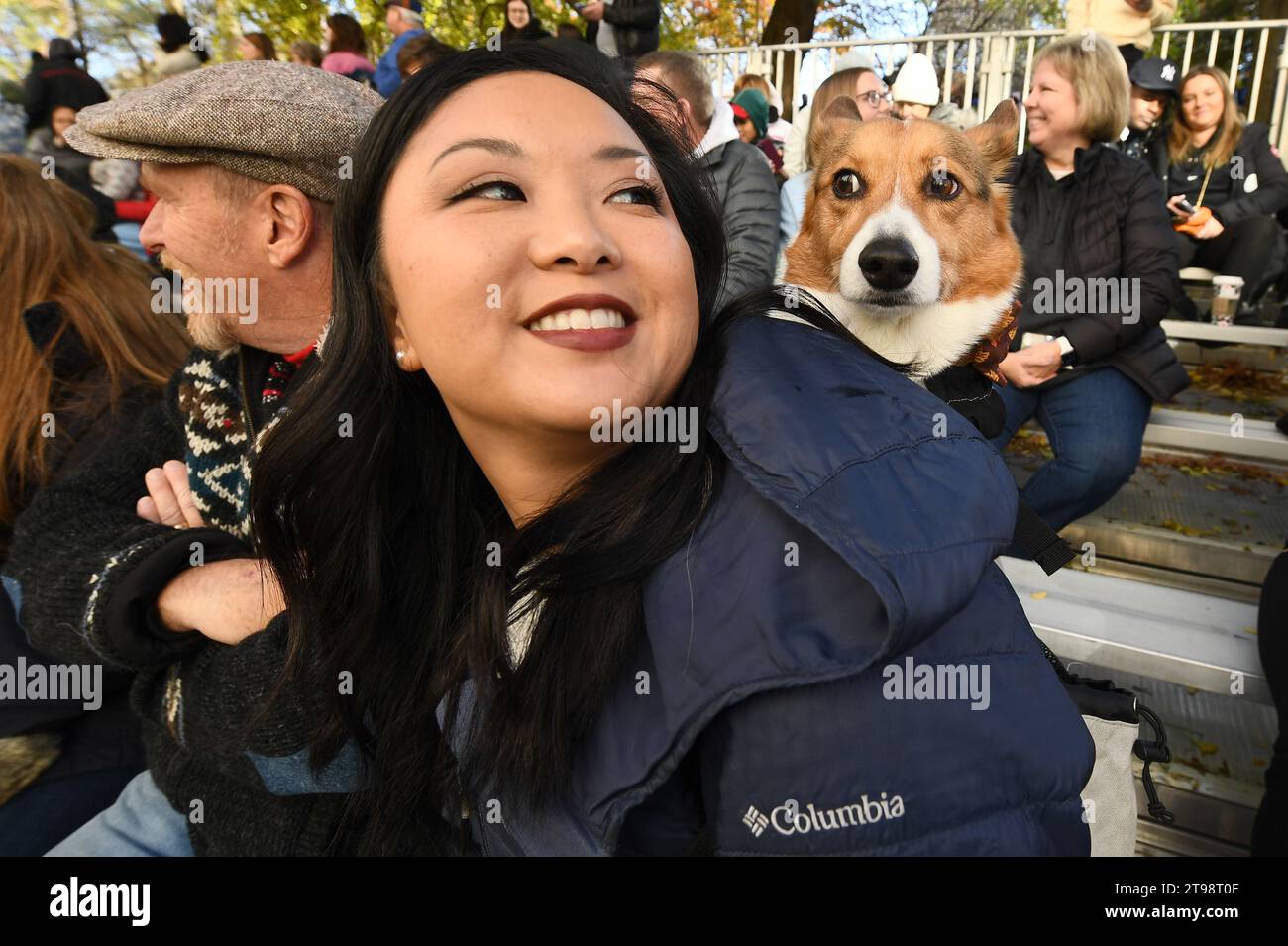 New York, USA. 23rd Nov, 2023. Sara Norris and her dog Clark sit along ...