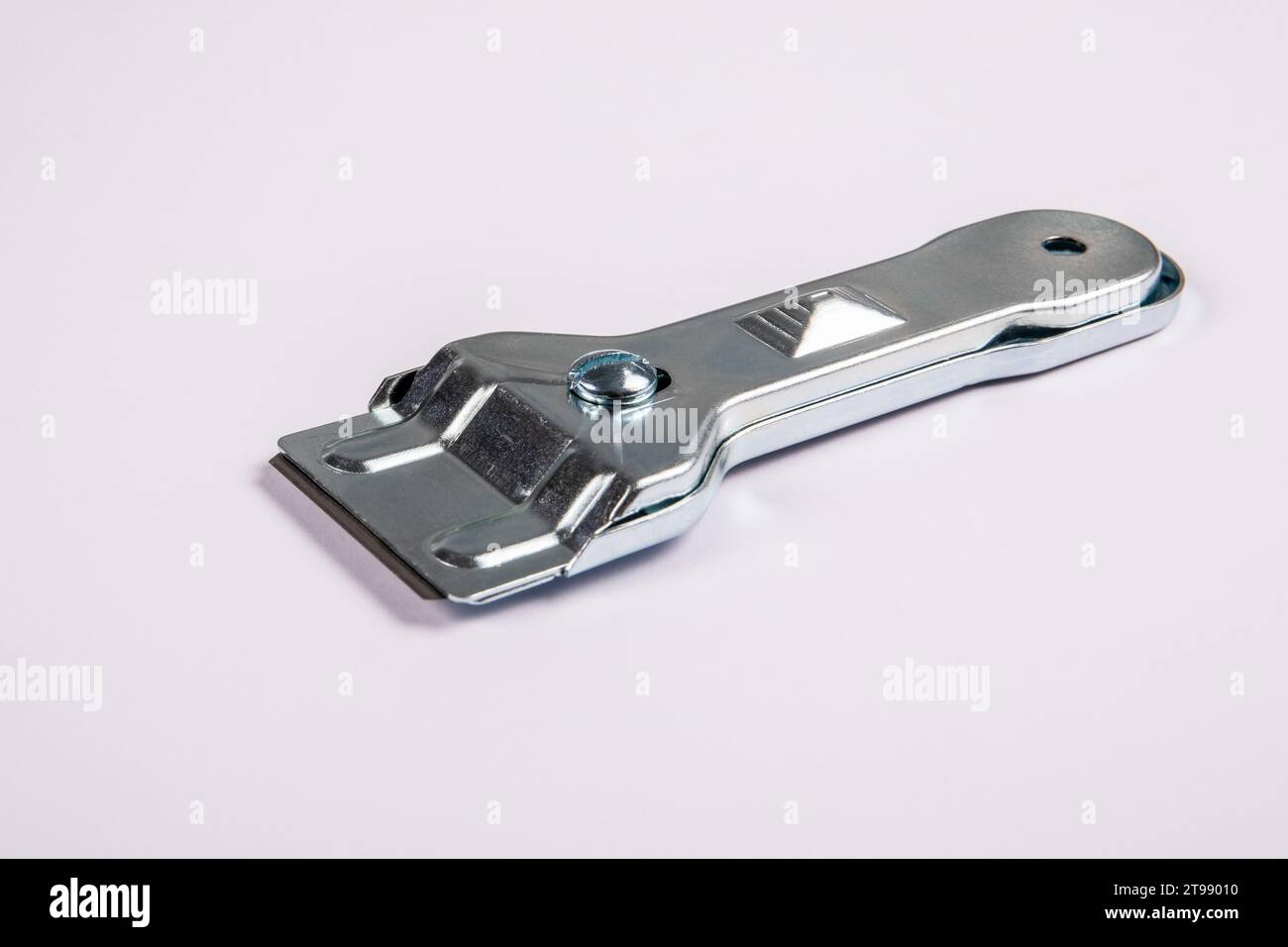 Glass ceramic scraper on a white background Stock Photo - Alamy