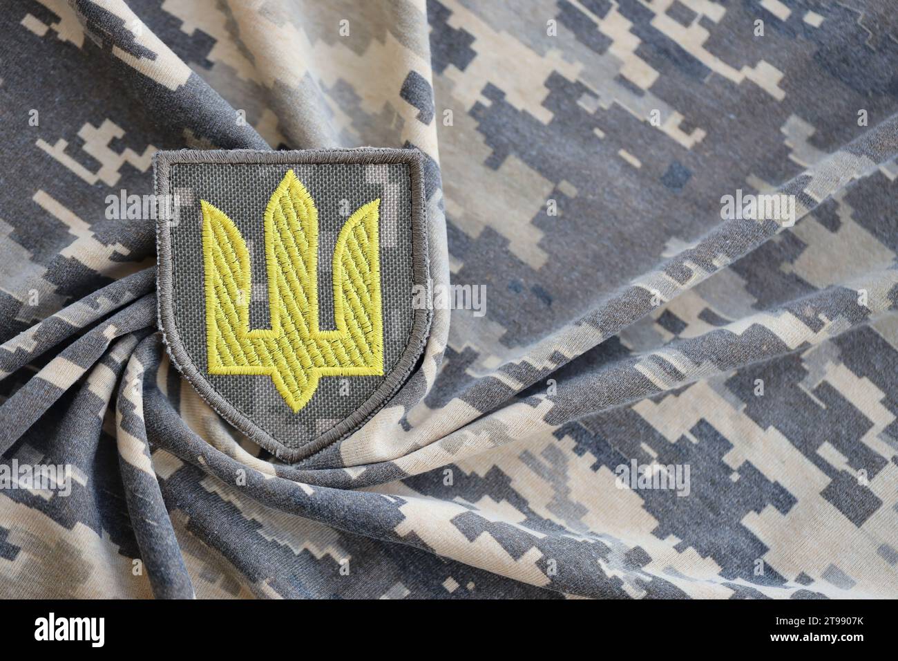 Symbol of Ukrainian army on the camouflage uniform of a Ukrainian ...