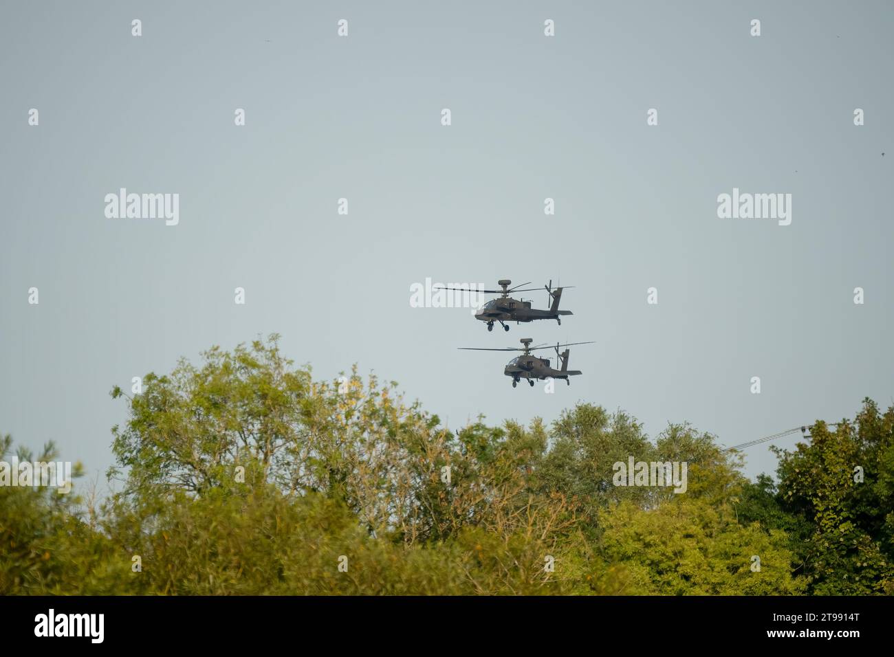a pair (two) British army Boeing Apache Attack helicopters AH64E AH-64E ...