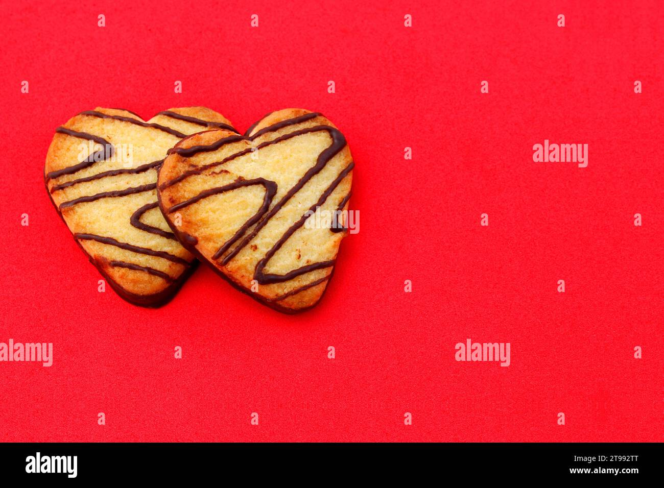Cookies with chocolate lines and heart shape Stock Photo - Alamy