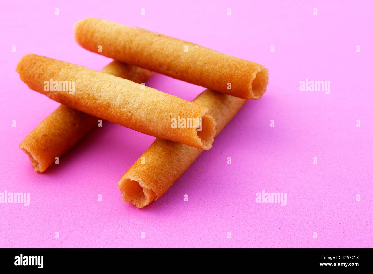 Sweet and crunchy cylinder-shaped wafers Stock Photo - Alamy