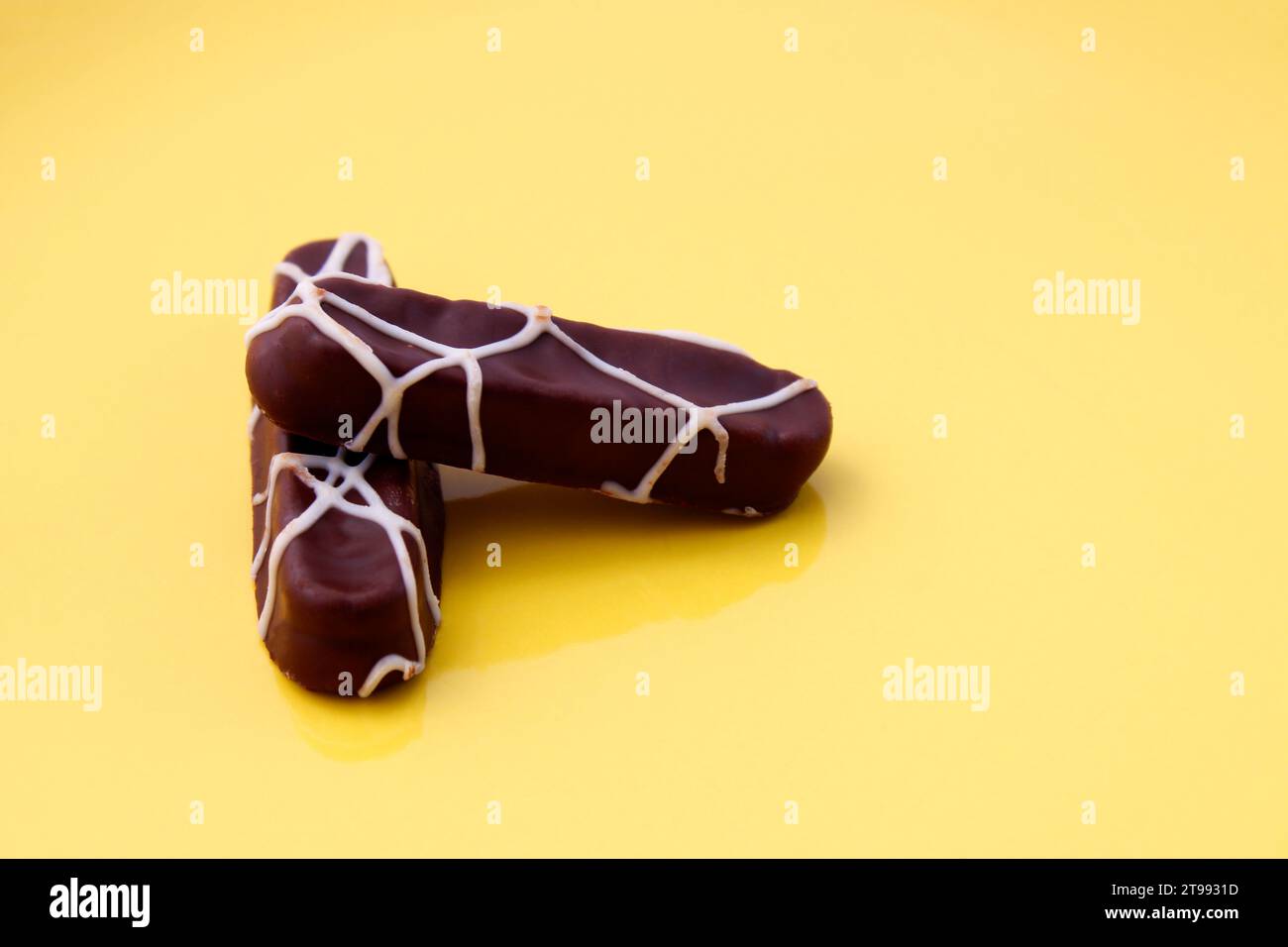 Chocolate covered cookies with white lines Stock Photo - Alamy