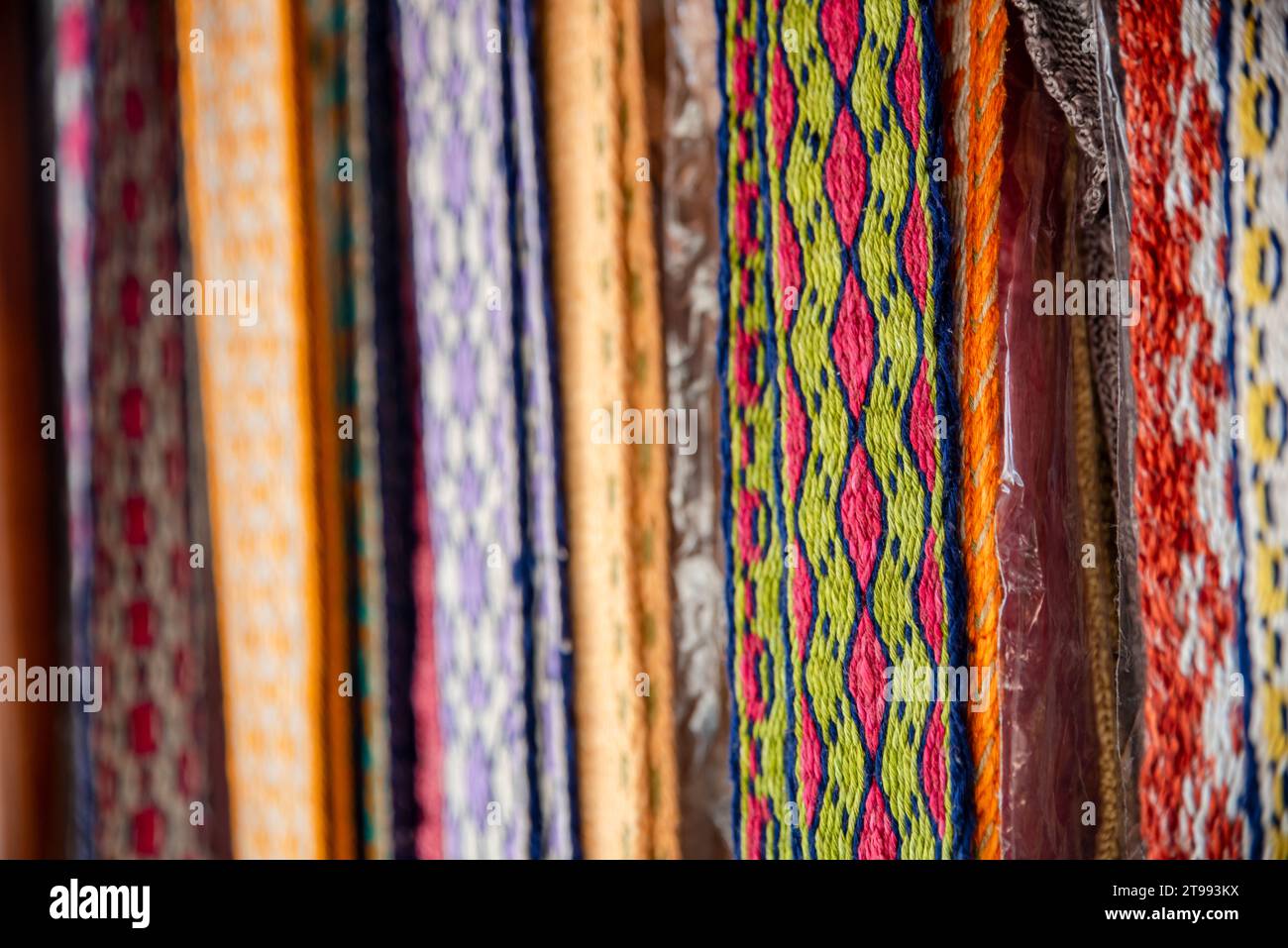 Many colorful belts with patterns. Folk art, handmade, Knitting of a ...