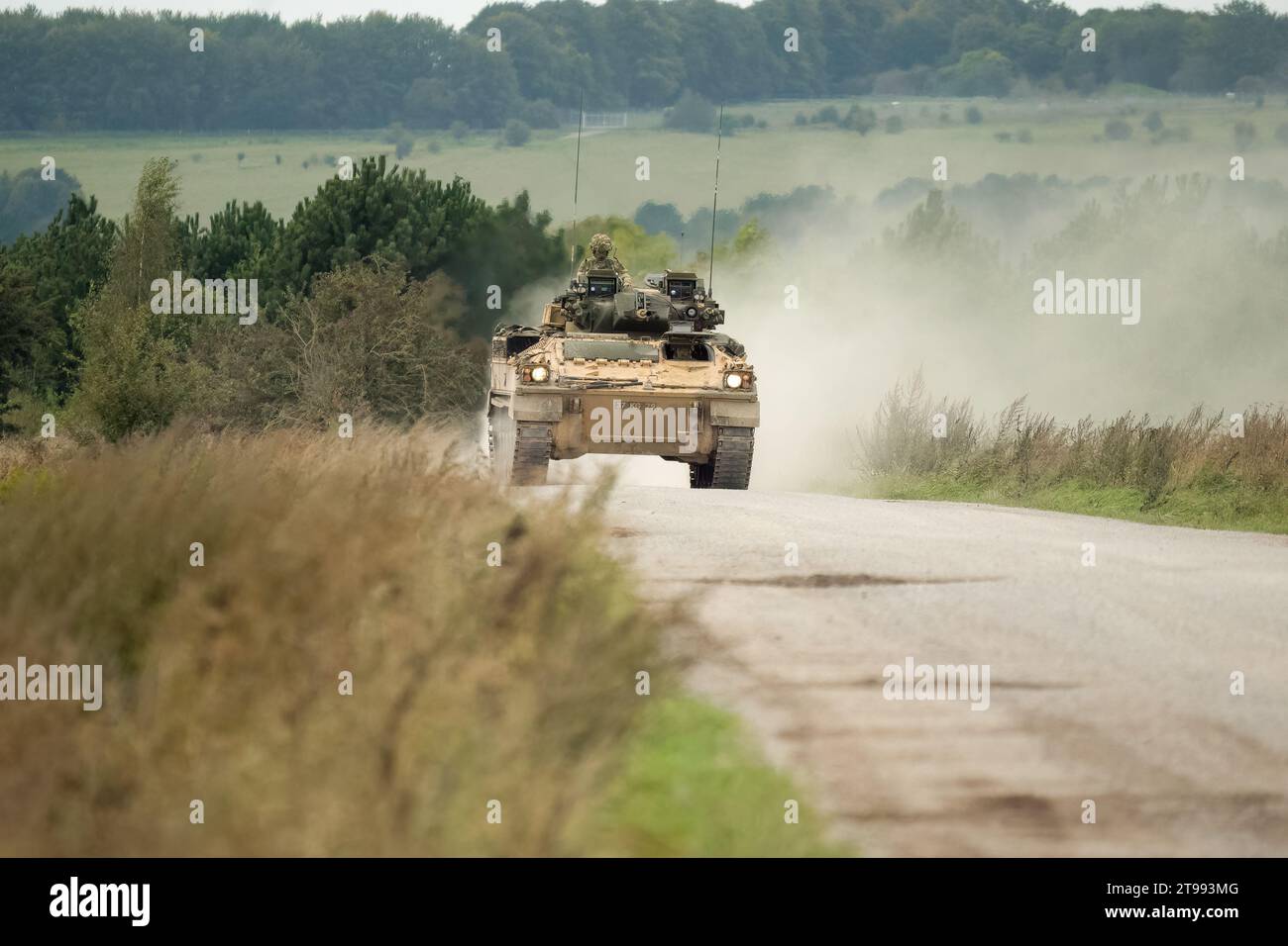 british army FV512 Warrior vehicle in action on manoeuvres Wiltshire UK ...