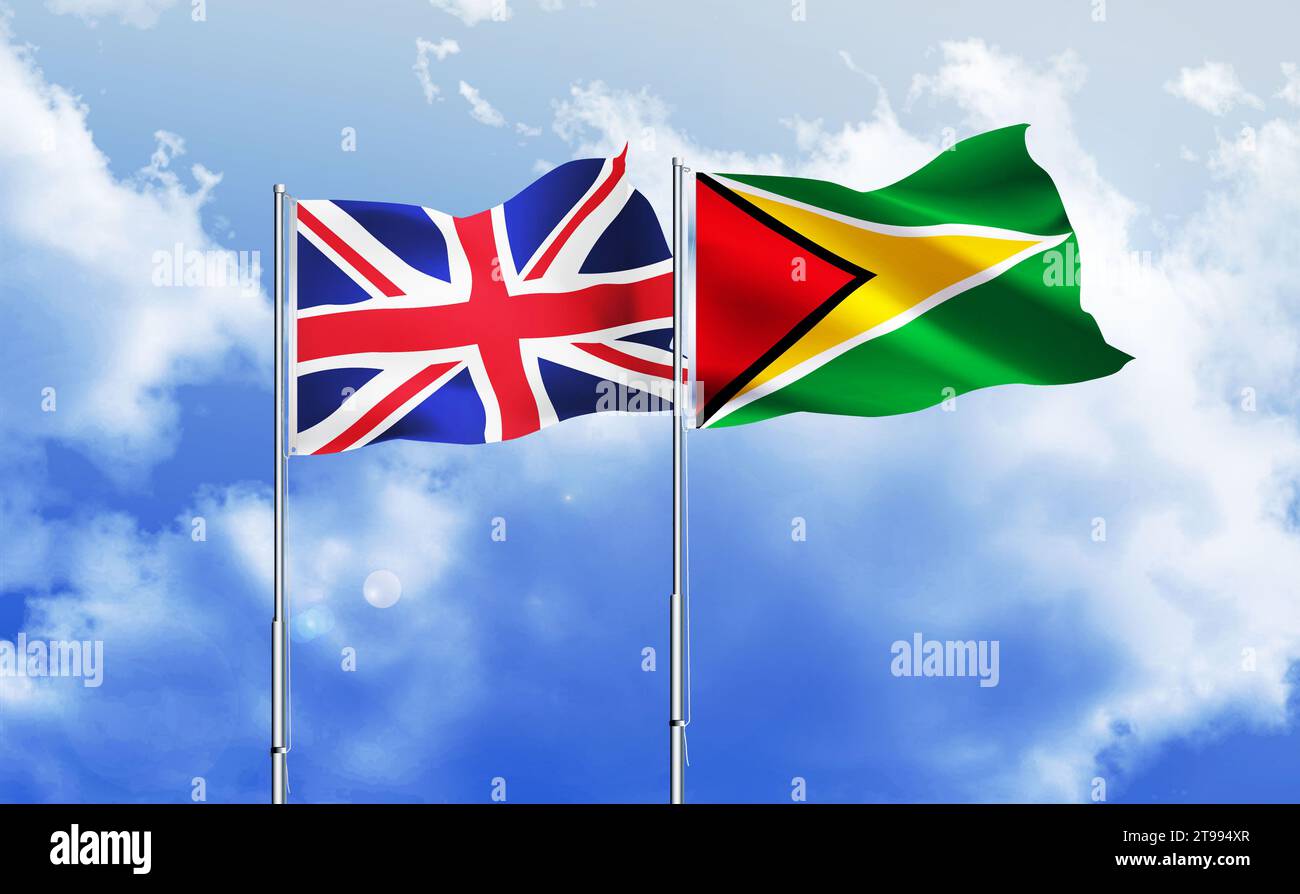 Guyana,UK flags together waving against blue sky Stock Photo - Alamy