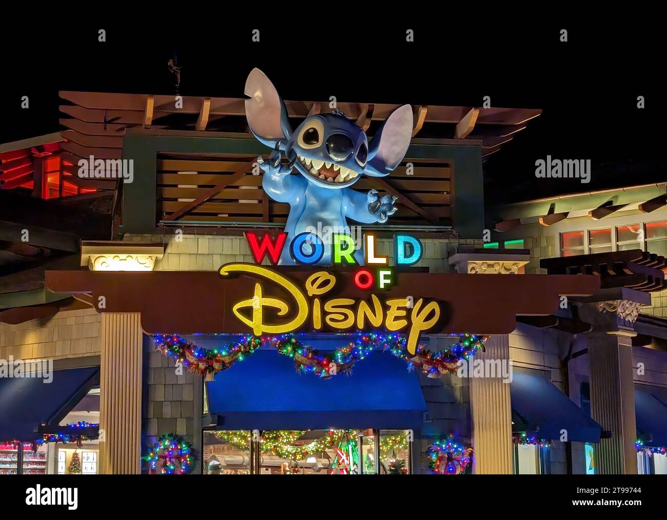 World of Disney store entrance sign with Stitch character sign at night ...