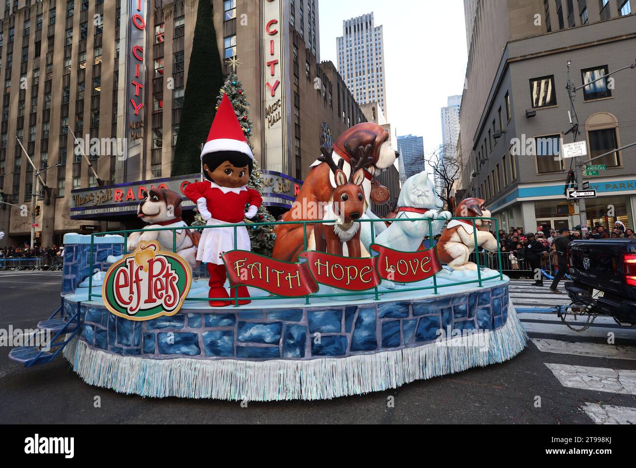 The Elf Pets float heads down the parade route during The 97th Macy's ...