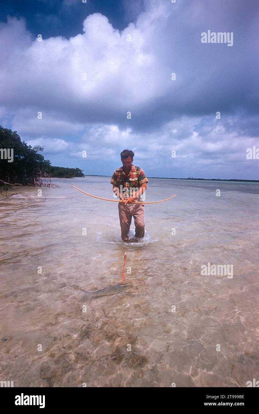 BAHAMAS - APRIL 7: Colyn Rees uses his bow and arrow as he shoots a ...