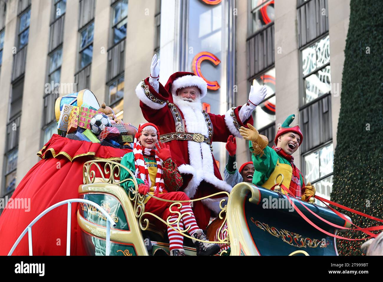 Claus float sleigh wave holiday hi-res stock photography and images - Alamy