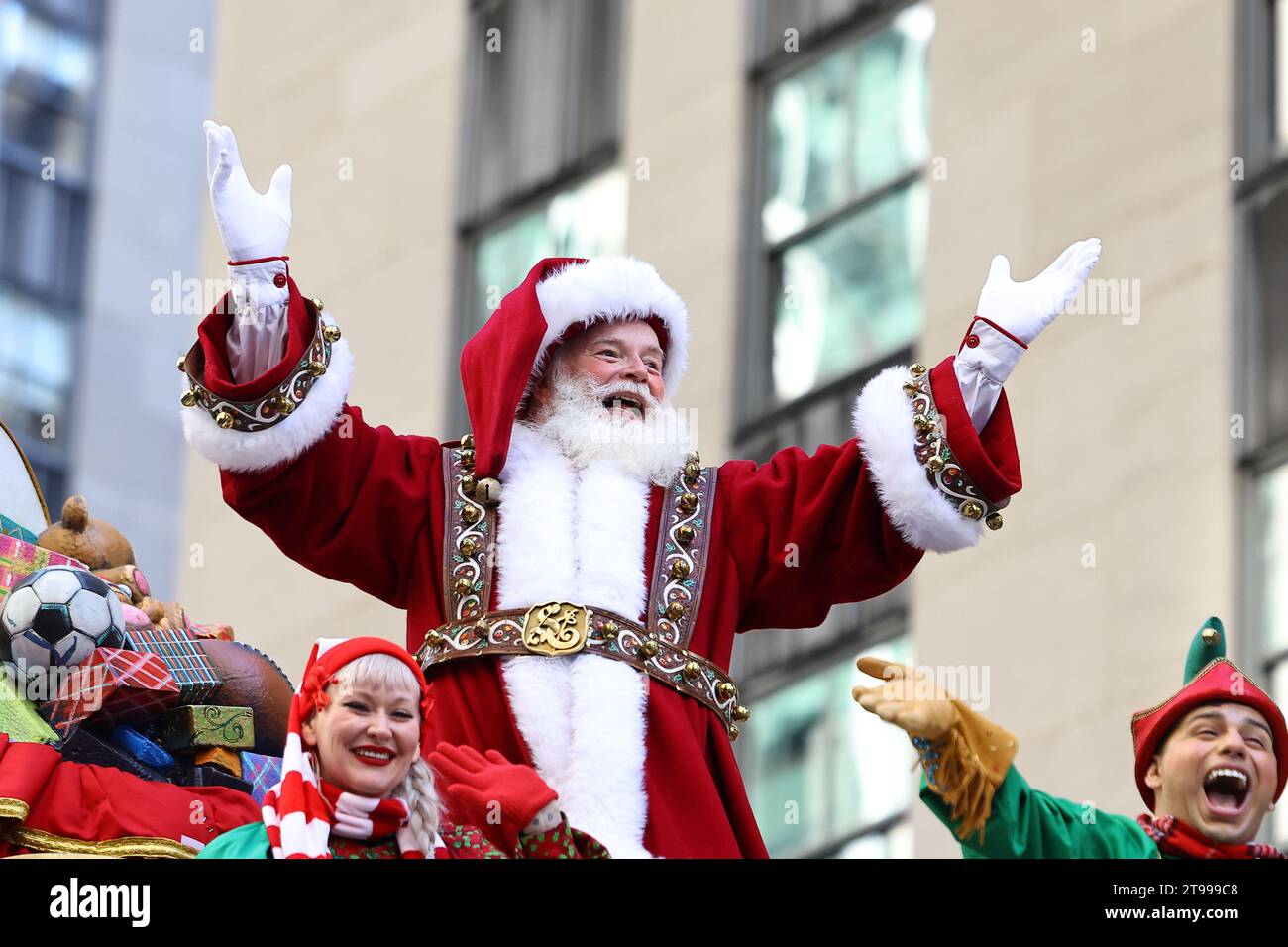 Santa Claus waves to the crowds from on top of the Macy's Santa's ...