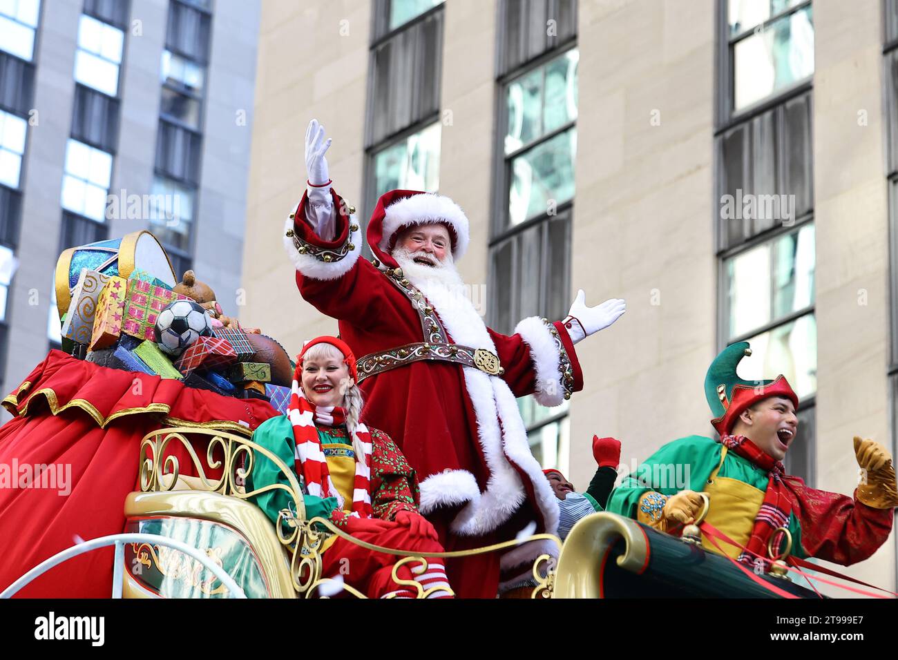 Santa Claus Waves To The Crowds From On Top Of The Macys Santas